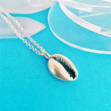 Sterling Silver Cowrie Shell Necklace • Megan Goldner Designs