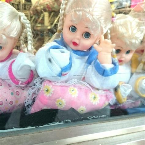 Premium Photo Dolls On Display Cabinet