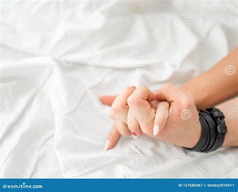 Close Up Hands Of A Couple Make Love Hot Sex On A Bed Stock Image