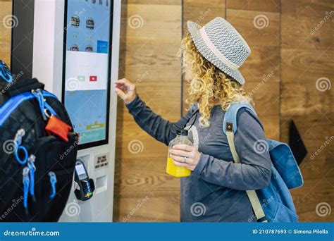 Woman Make Food Order In Modern Display At Fast Food Restaurant Self Service Panel Technology