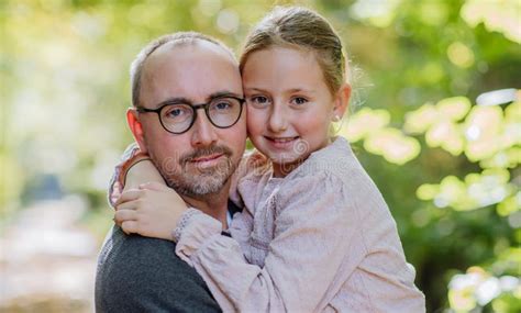 Portrait Of Father And His Little Daughter In Forest Stock Image