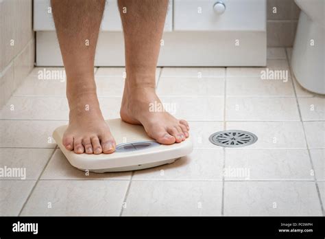 Overweight Man Standing On Scale Hi Res Stock Photography And Images Alamy