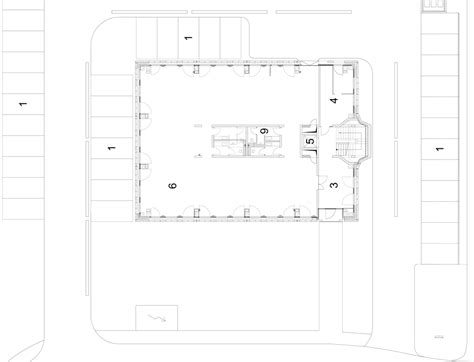 Neutrabuilding Houses Offices Behind A Concrete Shell Covered In Holes