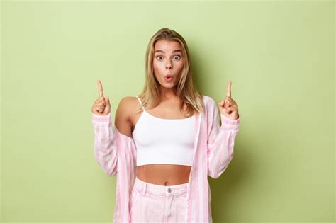 Premium Photo Blonde Girl In A Pink Outfit Posing