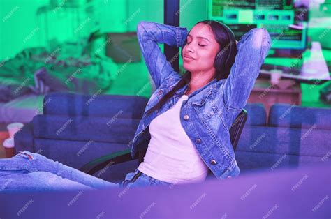 Premium Photo Woman Headphones Or Relax In Neon House After