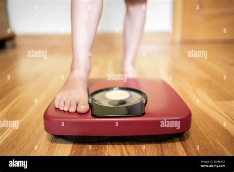 Close Up Of Girl Measures Weight On A Weight Scale Stock Photo Alamy