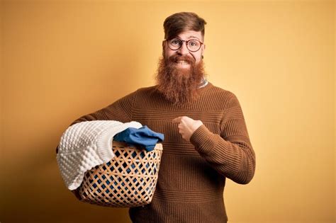 Premium Photo Redhead Irish Man With Beard Doing Housework Laundry
