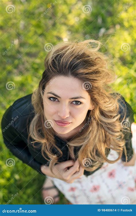 High Angle View Of Beautiful Happy Girl Smiling At Camera While