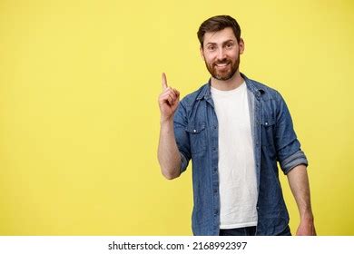 Smiling Man Raised Finger Sign He Stock Photo 2168992397 Shutterstock