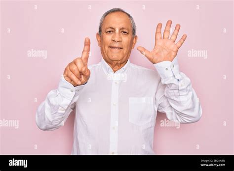 Senior Handsome Grey Haired Man Wearing Elegant Shirt Over Isolated