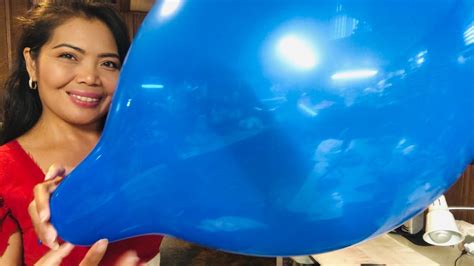 Blowing Blue Balloon Inflating And Deflating And Scratching And Rubbing
