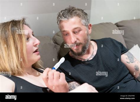 Excited Married Couple Discovering Result Of Pregnancy Test Surprised