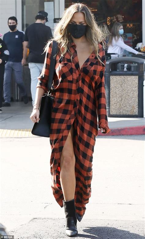 Chrissy Teigen Puts On A Leggy Display In Buffalo Plaid Shirt Dress As