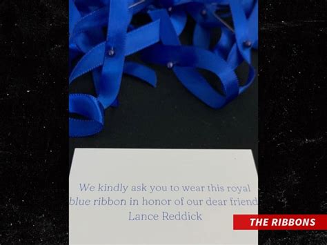 Lance Reddick Honored At John Wick 4 Premiere With Blue Ribbons