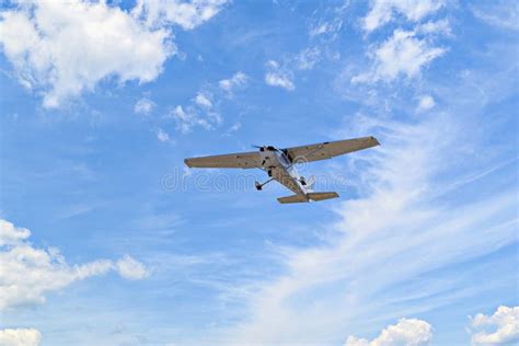 Light Aircraft Flying Over Blue Sky Stock Image Image Of Wing