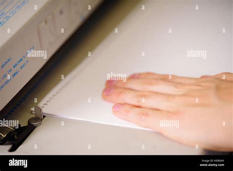 Using Binding Machine For Binding Documents With Plastic Ring Binder Stock Photo Alamy