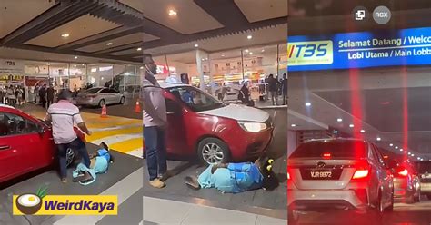 Msian Woman Pretends To Get Hit By A Taxi Refuses To Leave Even After