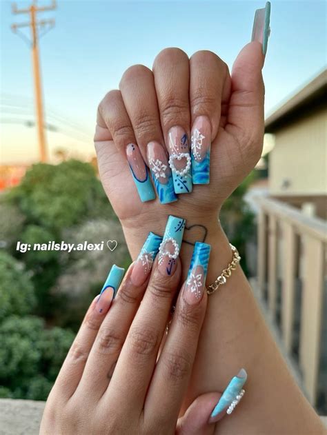 Blue French Tip Nails With Hibiscus Flowers And Charms