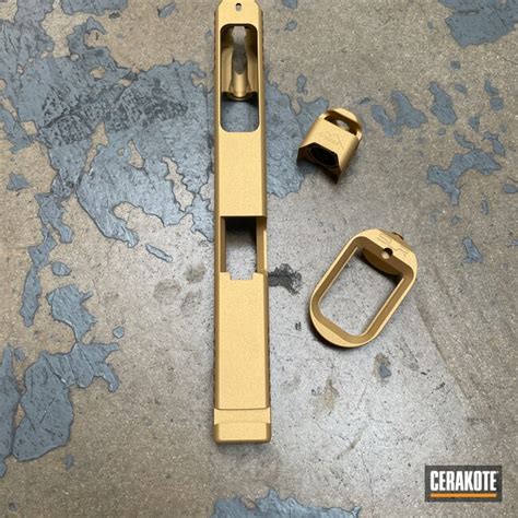 Glock Slide And Components Cerakoted Using Gold Cerakote