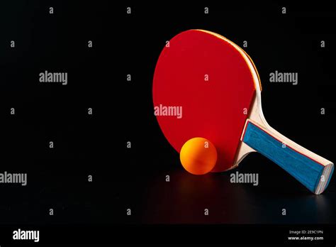 Red Ping Pong Racket On Dark Background Stock Photo Alamy