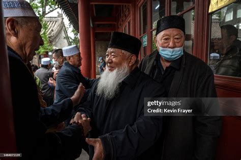 Chinese Hui Muslim Men Greet Each Other After Eid Al Fitr Prayers At