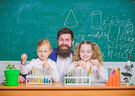 In Lab Small Girls Holding Test Tubes In School Laboratory Stock Image Image Of Informal