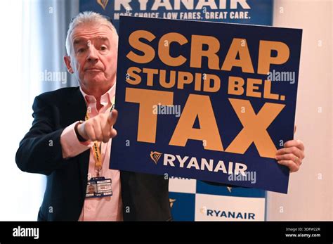 Ryanair Ceo Michael Oleary Poses With A Slogan At A Press Conference