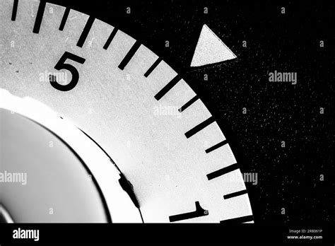 Monochrome Close Up Of An Analog Laboratory Timer Set To Seven Stock