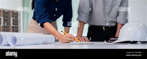 Two Architects Are Discussion And Analysis About Construction Of
