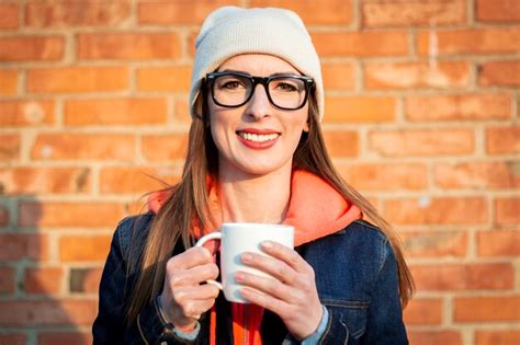 Premium Photo Woman Holding A Mug With Coffee