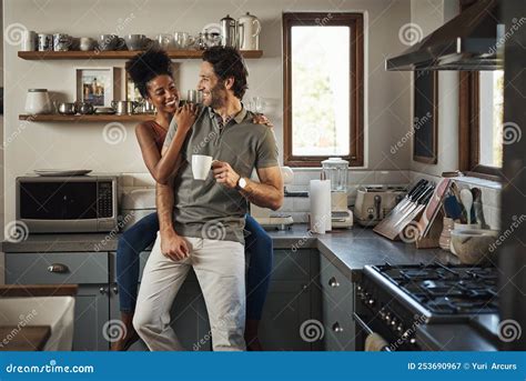 Happy In Love And Laughing While An Interracial Couple Enjoys Morning