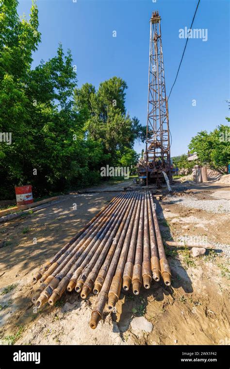 Extension Drilling Rods In Front Of Old Water Pump Truck That Extracts