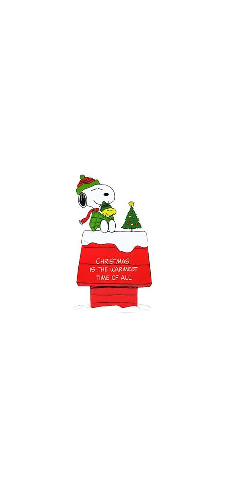 Download A Festive Snoopy Celebrates The Holidays With Iphone In Hand Wallpaper