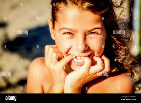 Beautiful Eight Year Old Girl Smiling On The Beach Stock Photo Alamy