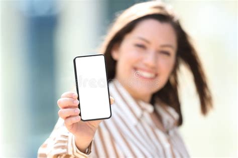 Happy Business Woman Showing Blank Phone Screen Outdoor Stock Photo