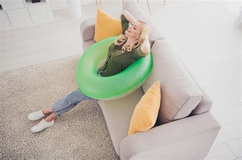 Top View Photo Of Cute Adorable Woman Hold Arms Behind Head Enjoy Summer Vacation Lifebuoy