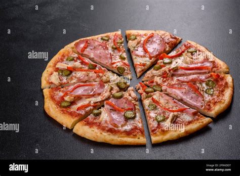 Delicious Fresh Crispy Pizza From The Oven With Ham And Bulgarian