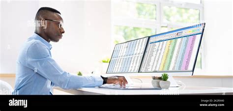 Data Analyst African Man Using Spreadsheet Stock Photo Alamy