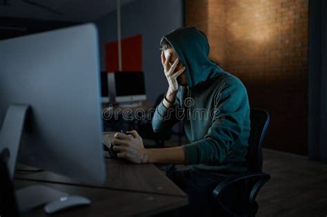 Serious Male Hacker In Hood Works On Computer Stock Image Image Of Internet Data