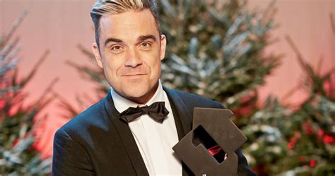 King Of The Swingers Robbie Williams Scores Uks Historic 1000th Number