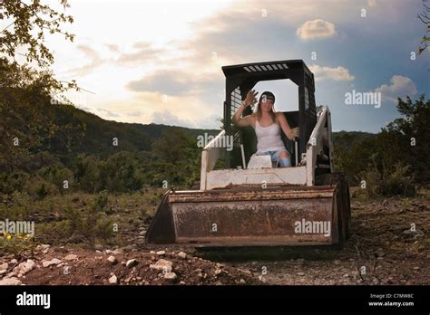 Female Construction Showing OK Sign While Operating Bobcat Front Loader Stock Photo Alamy