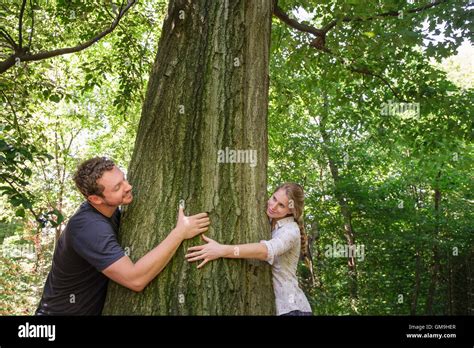 Couple Hugging Tree Stock Photo Alamy