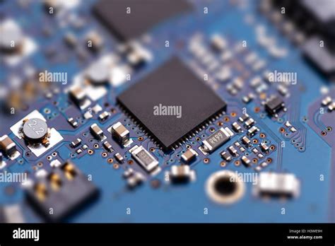 Integrated Semiconductor Microchip Microprocessor On Blue Circuit Board Stock Photo Alamy