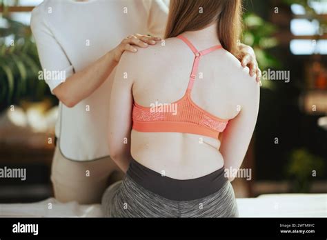 Healthcare Time Closeup On Female Massage Therapist In Massage Cabinet