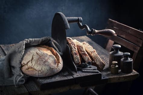 Premium Photo Healthy Loaf Of Bread On Old Slicer