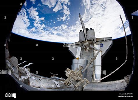 Space Shuttle Discovery Docked At The International Space Station