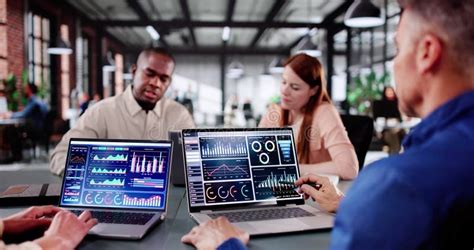 Analyzing Business Data With A Multicultural Team Stock Image Image