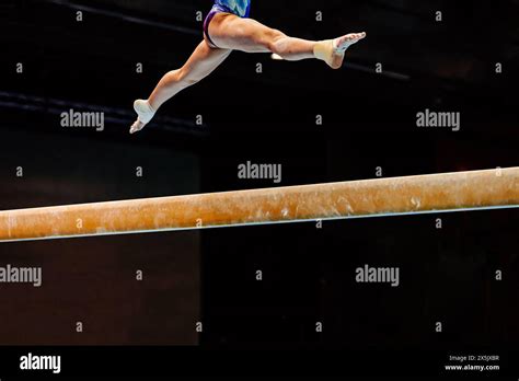 Legs Woman Exercise Split Jump On Balance Beam Gymnastics In Black