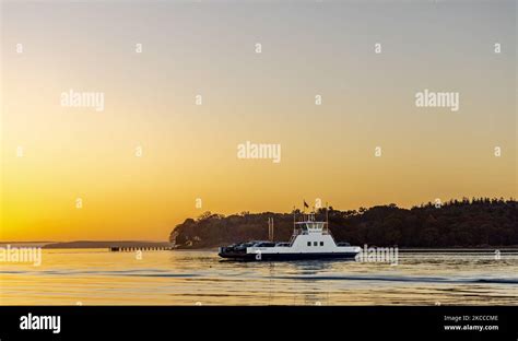 Shelter Island Ferry Making An Early Morning Crossing With The Sun