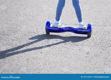 Girl Riding Blue Electric Battery Powered Hoverboard For Balance